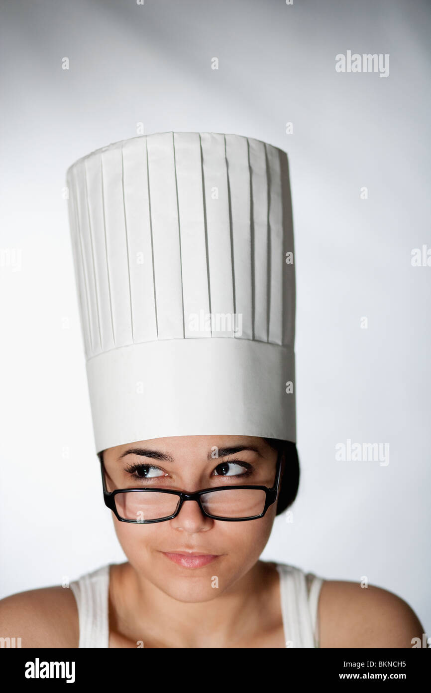 Hispanic woman in chef's hat and eyeglasses Stock Photo - Alamy