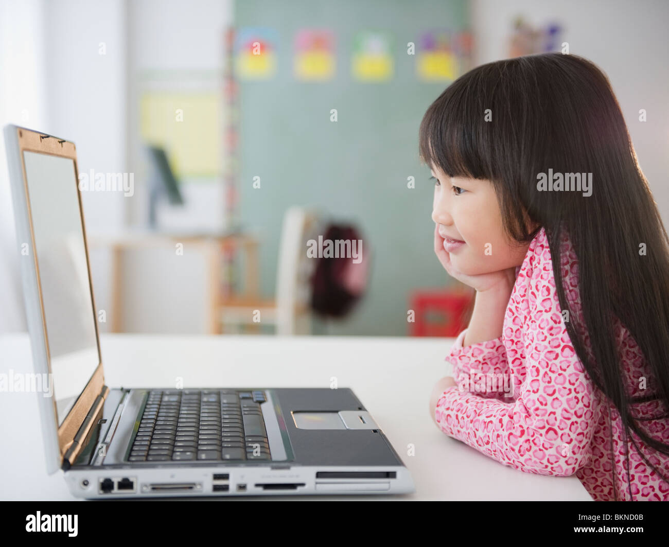 Chinese girl using laptop in classroom Stock Photo - Alamy