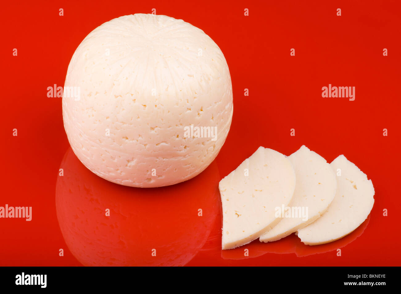 object on red - food cheese close up Stock Photo - Alamy