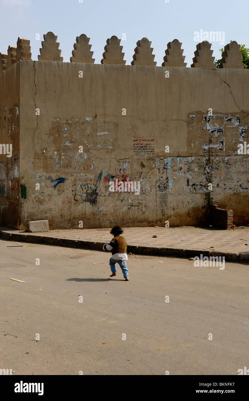 little boy running through the street , old cairo , egypt Stock Photo ...
