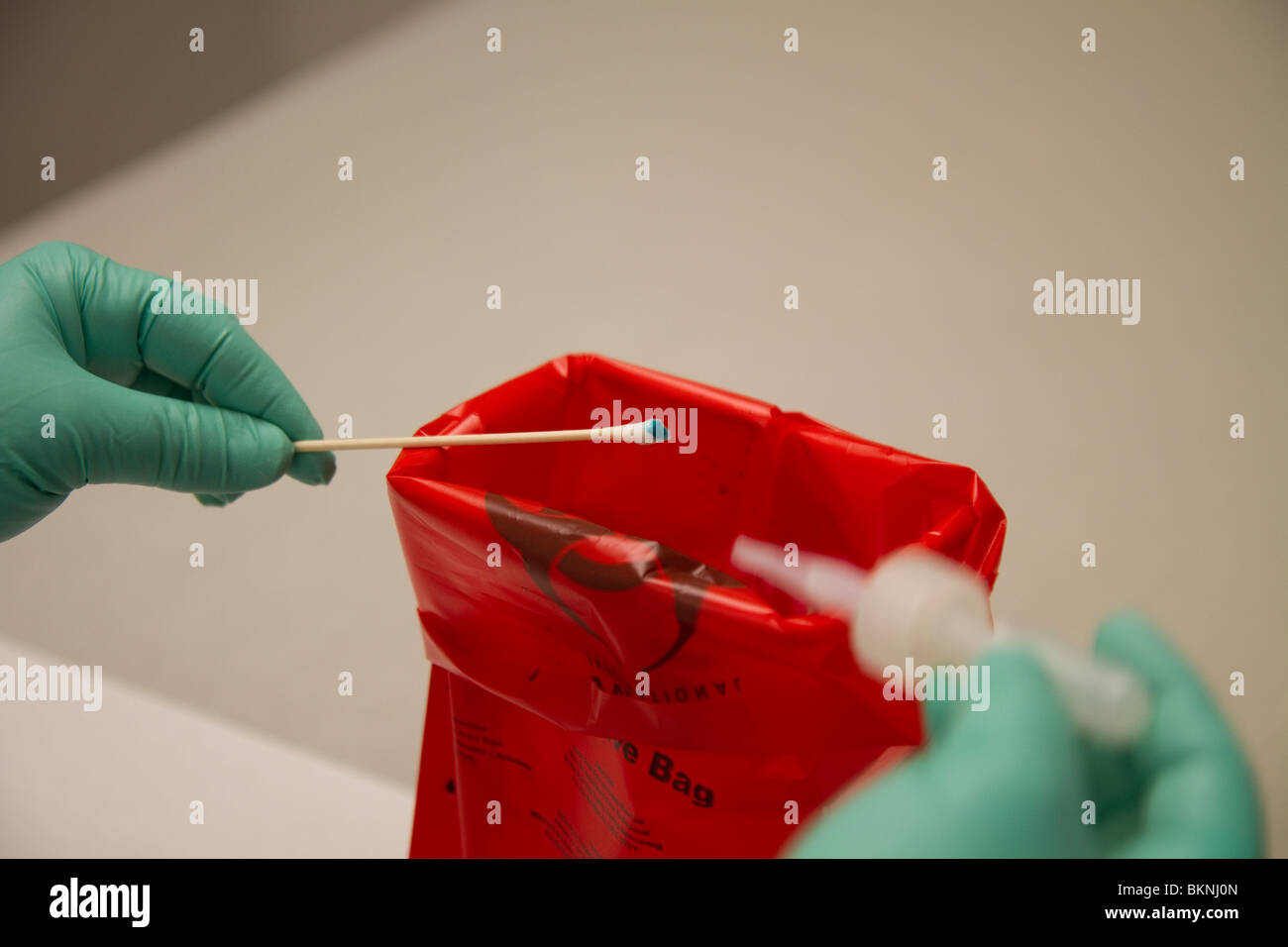 Testing to see if a stain on clothing is blood. Nebraska State Police ...