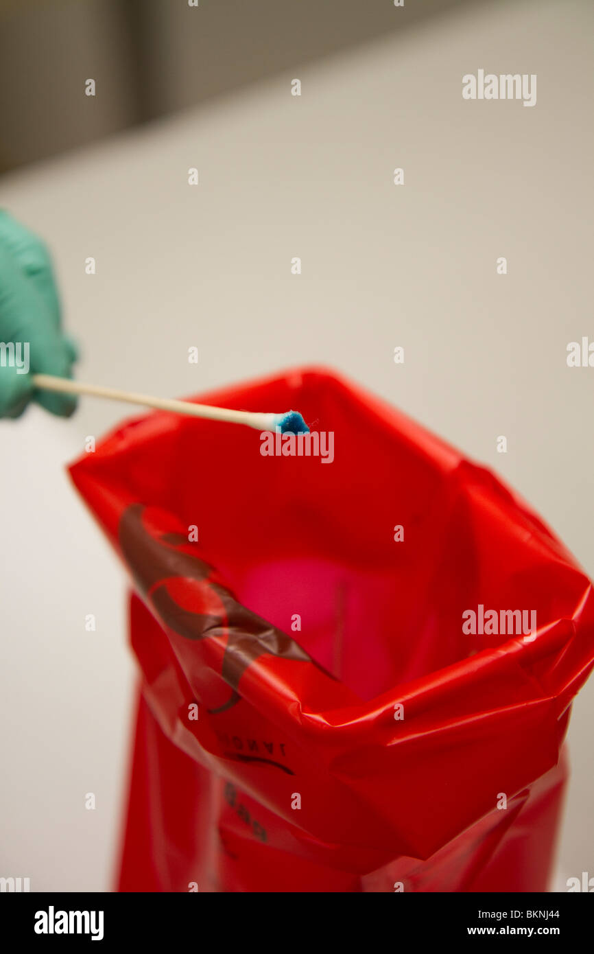 Testing to see if a stain on clothing is blood. Nebraska State Police ...