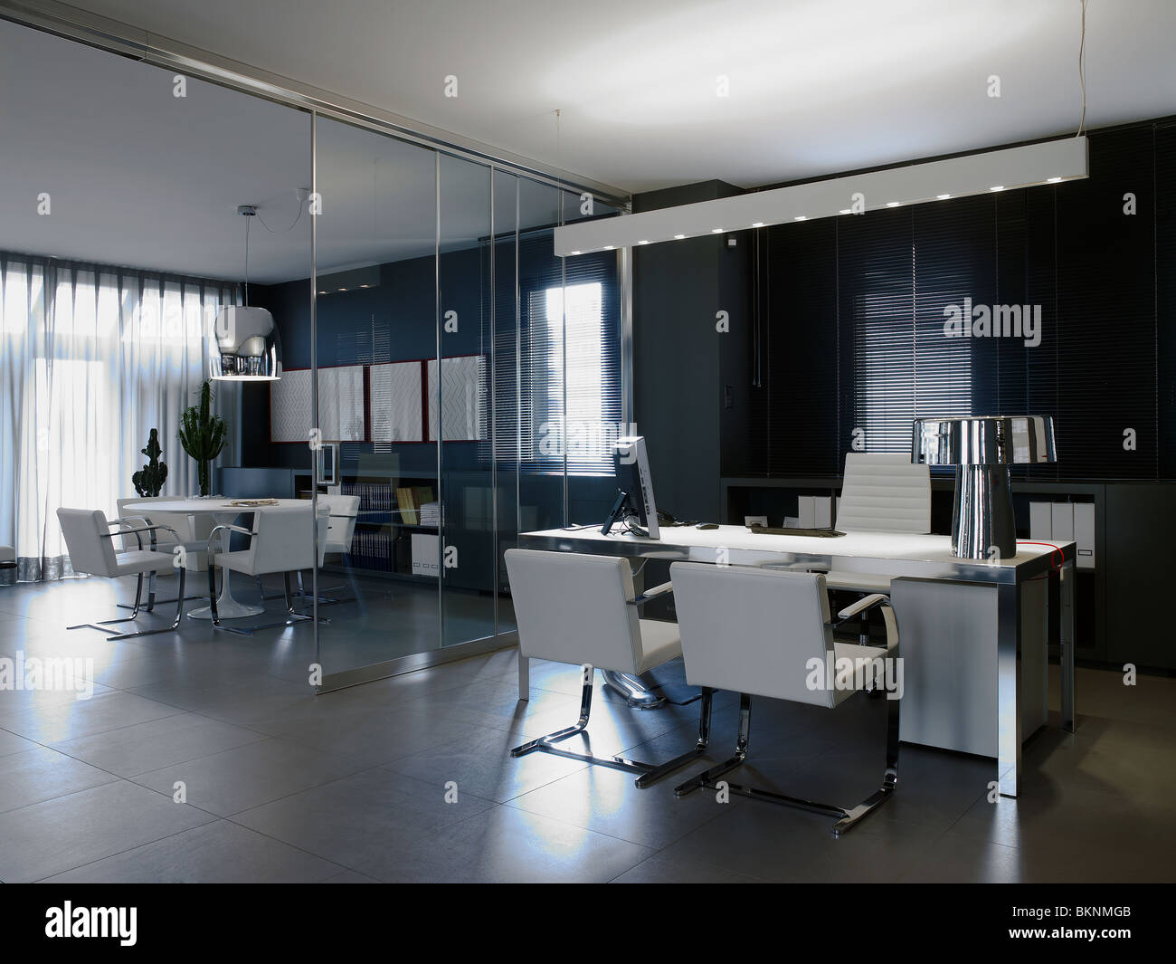 Office environment with tables, desks, chairs and computers Stock Photo ...