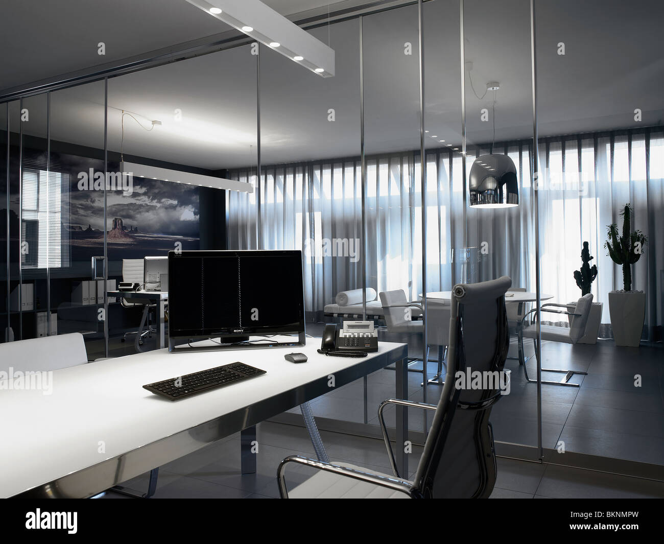 Office environment with tables, desks, chairs and computers Stock Photo ...