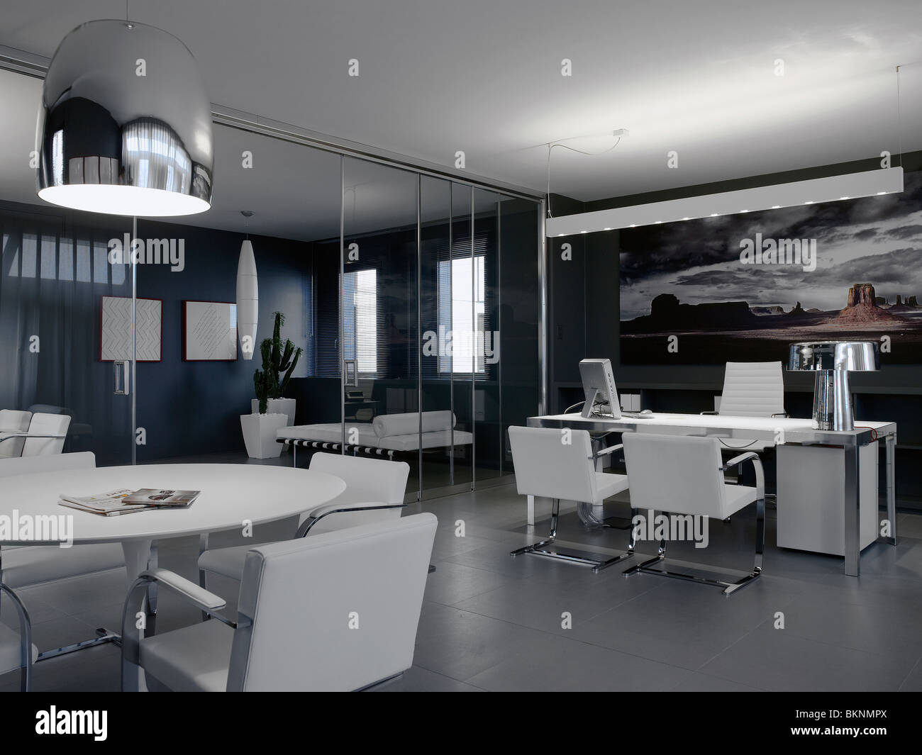 Contemporary Office environment with tables, desks, chairs and ...