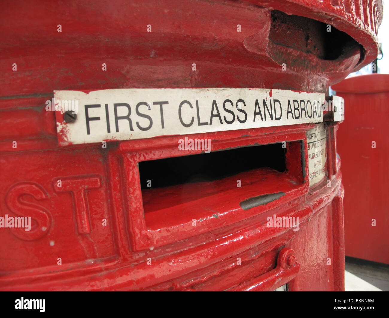 Royal Mail Red post box First class postage London UK Stock Photo - Alamy