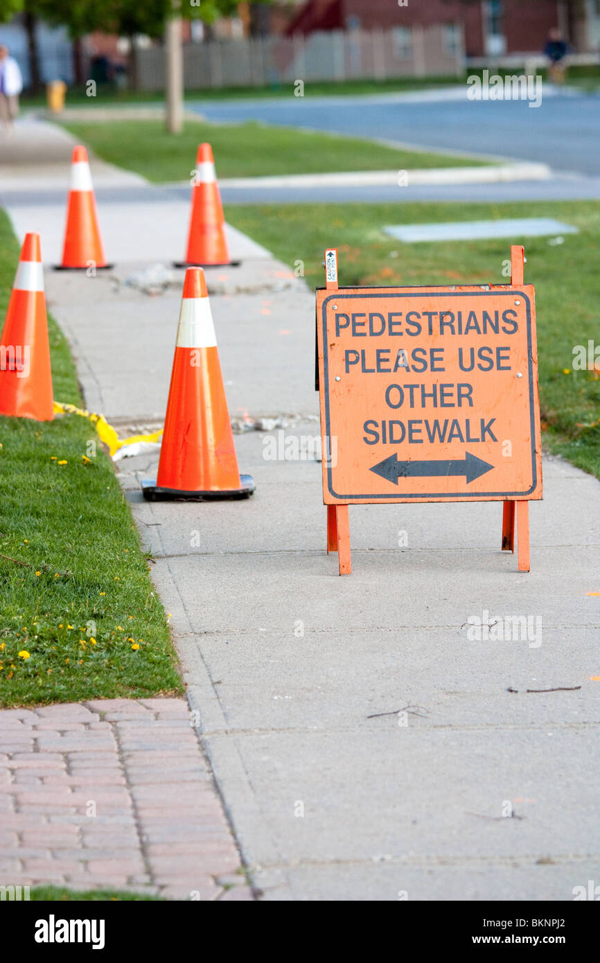 pedestrians please use other side walk orange sign broken road orange ...
