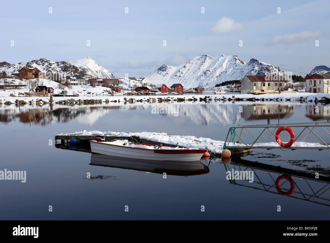 Dinghy's moored in the harbour of Ballstad fishing village on Vestvågøy ...