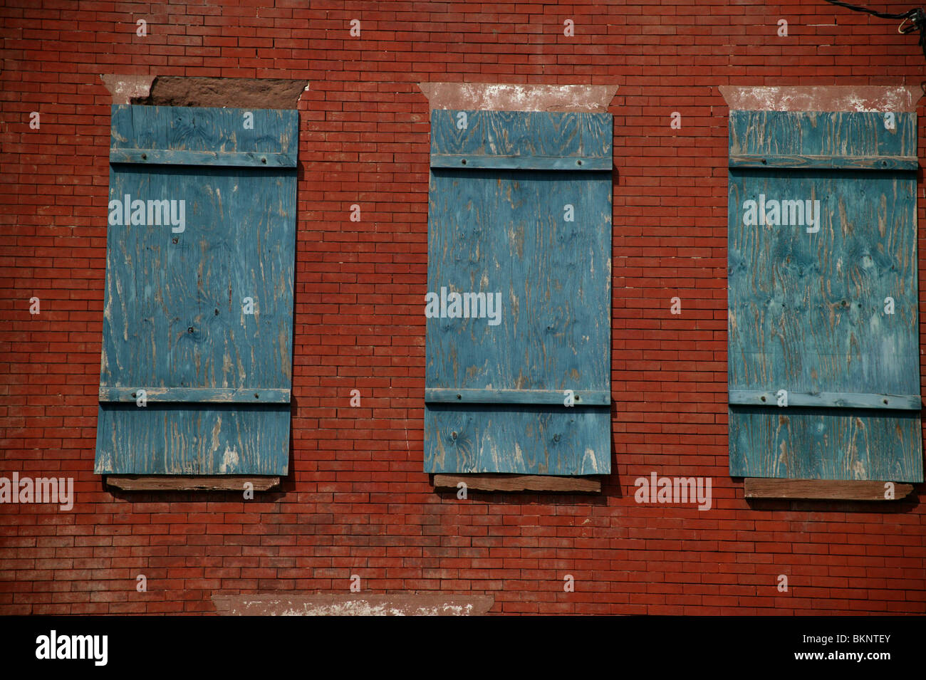 red brick wall blue windows Stock Photo - Alamy