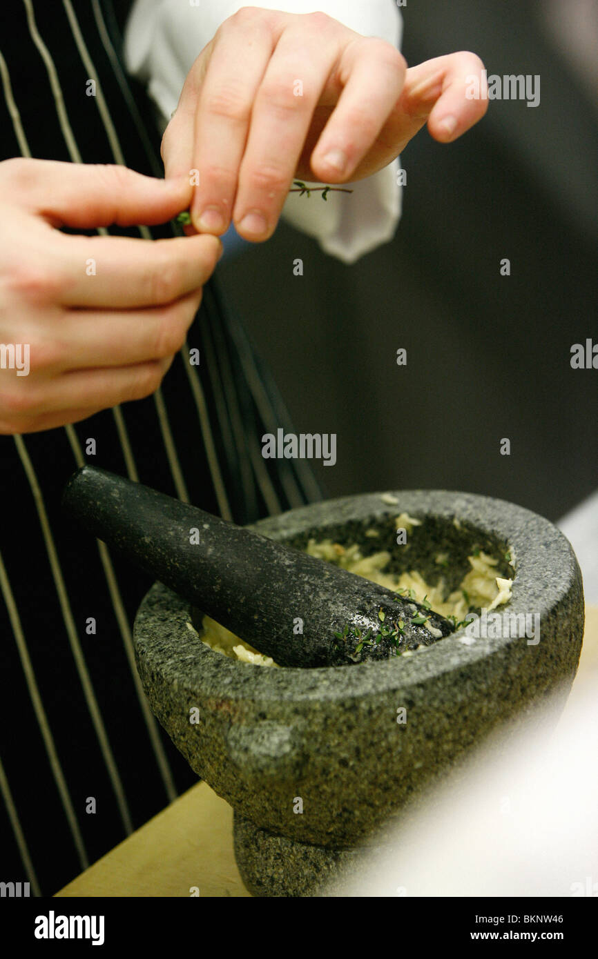 Food preparation in a restaurant kitchen - pestle & mortar Stock Photo ...