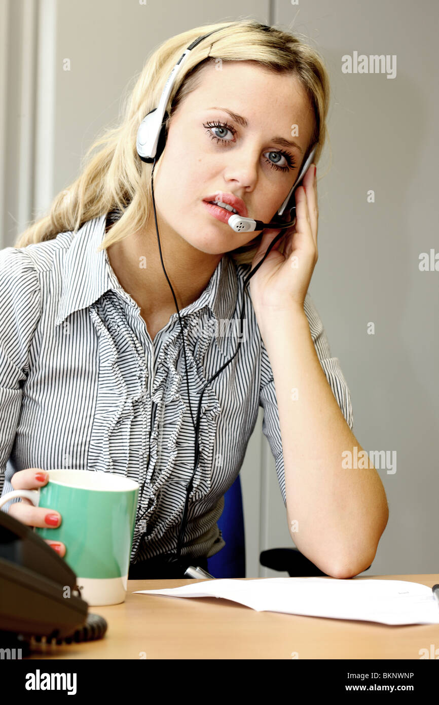 Young Trainee Business Woman Working In An Office With A UK Government ...