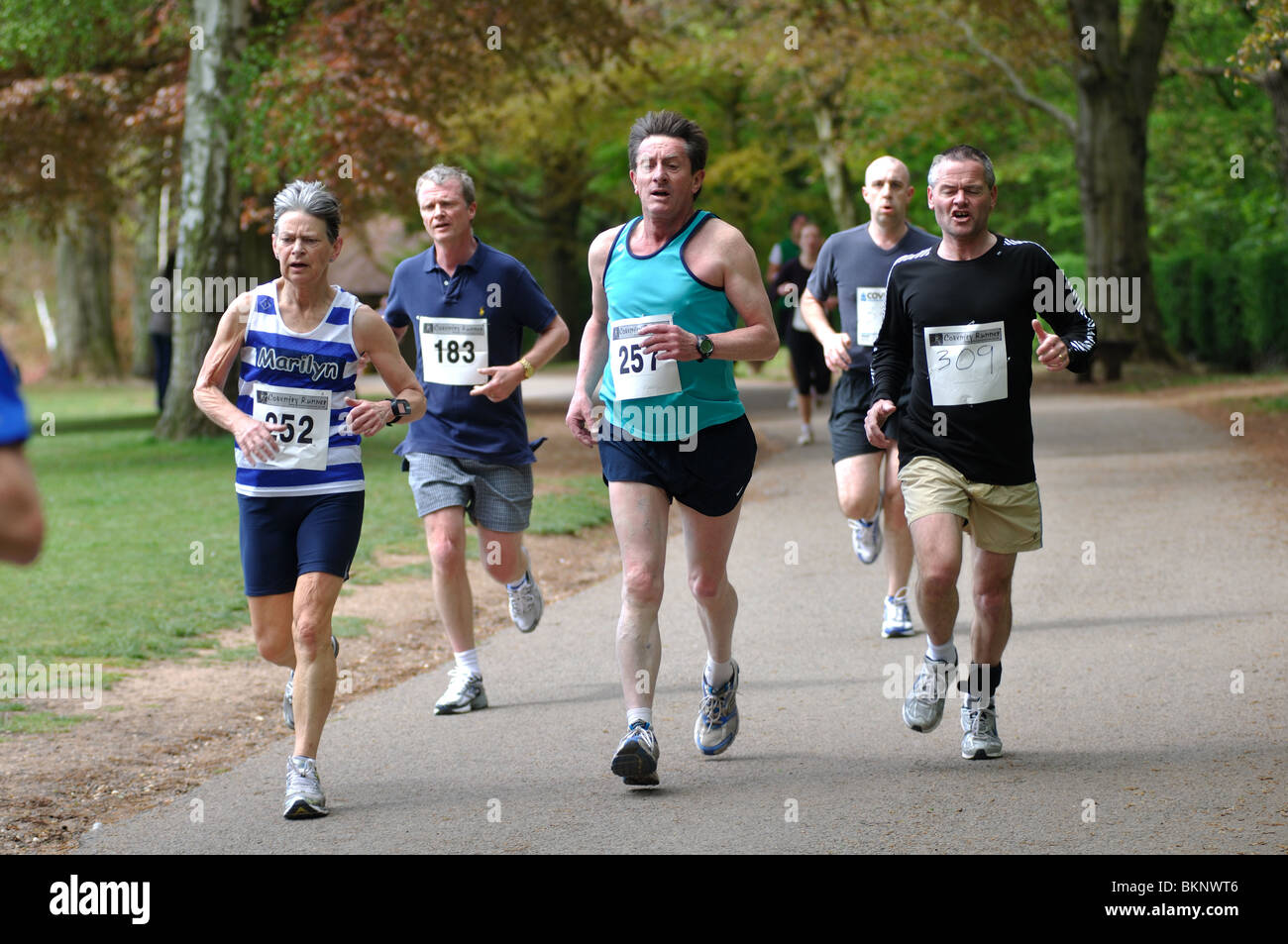 Group running in park england hi-res stock photography and images - Alamy