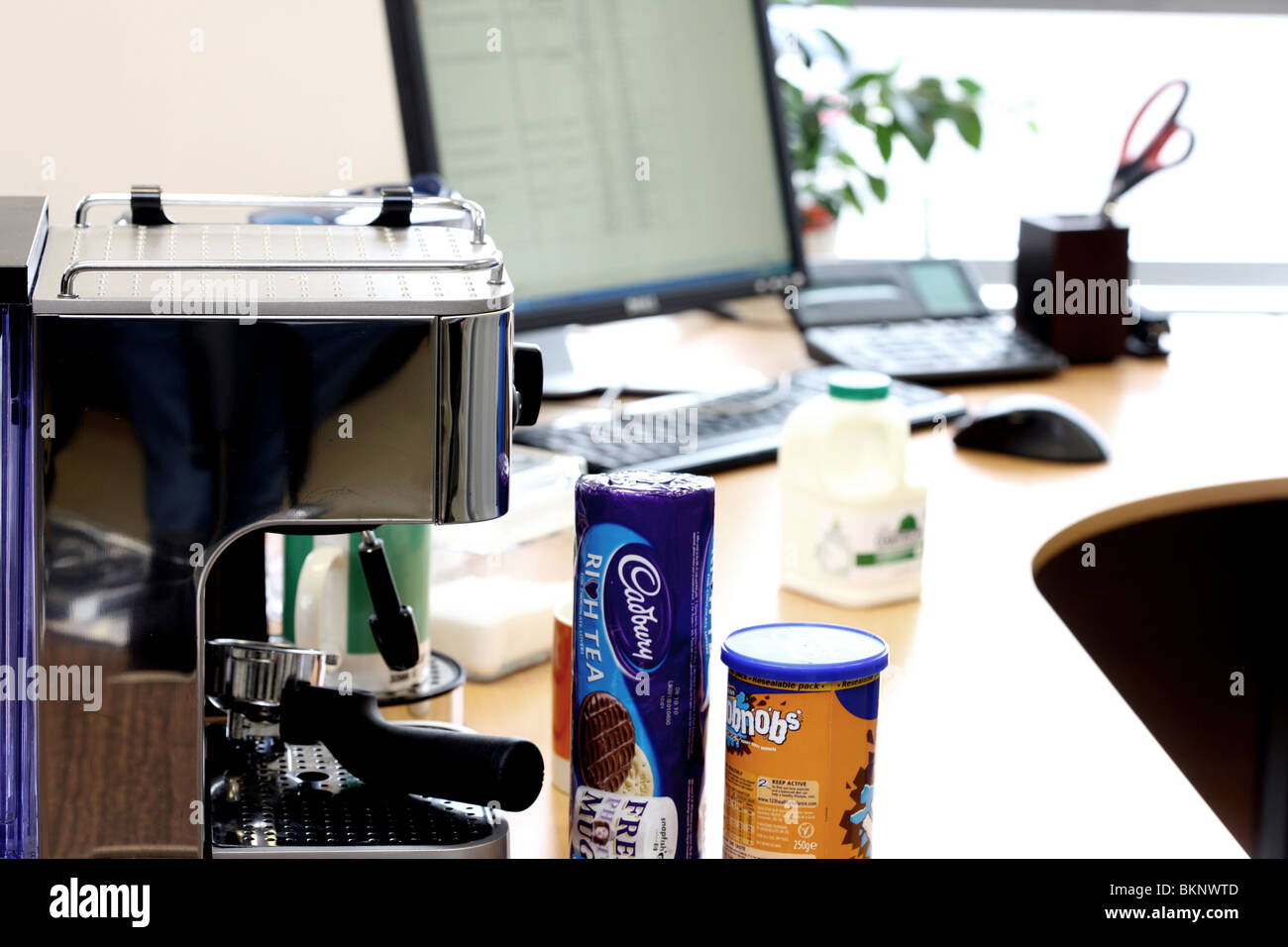 Office Biscuits and Coffee Machine Stock Photo - Alamy
