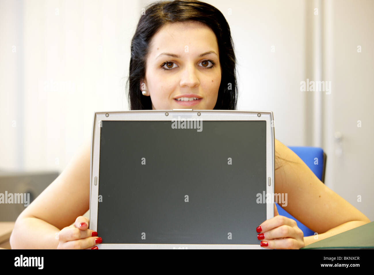 Young Woman with Laptop Computer. Model Released Stock Photo - Alamy