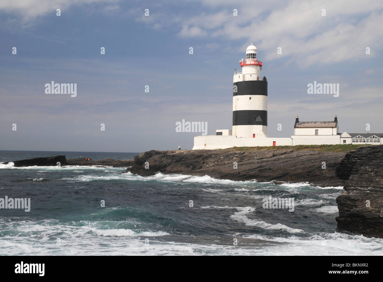 The Hook lighthouse on a rocky outcrop of the Hook Peninsula, Co ...