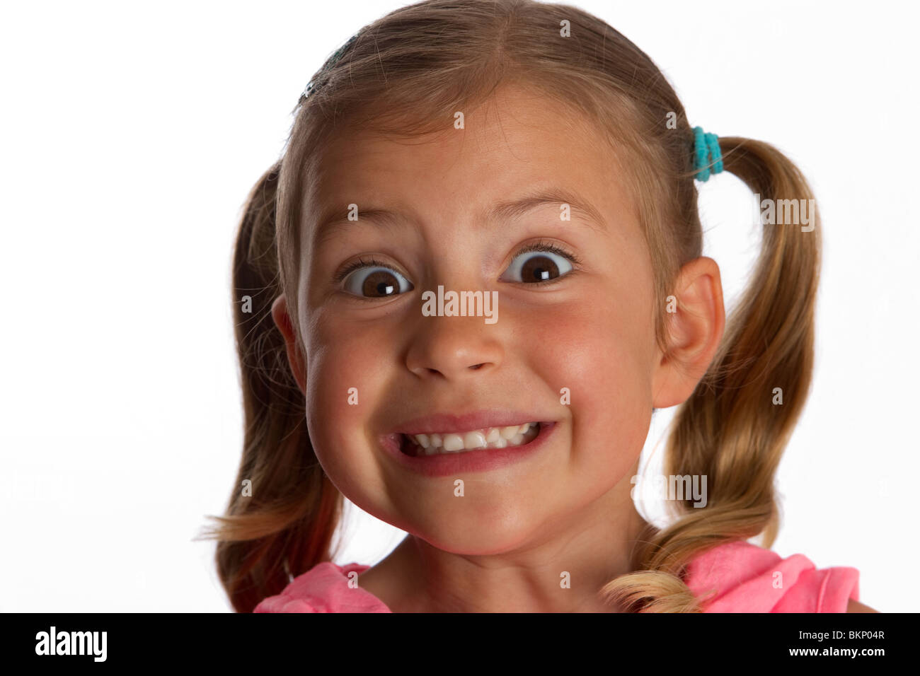 Pretty little girl clenching her teeth Stock Photo - Alamy
