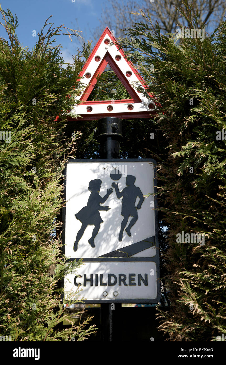 An old highways roadside triangular reflective warning sign showing two ...