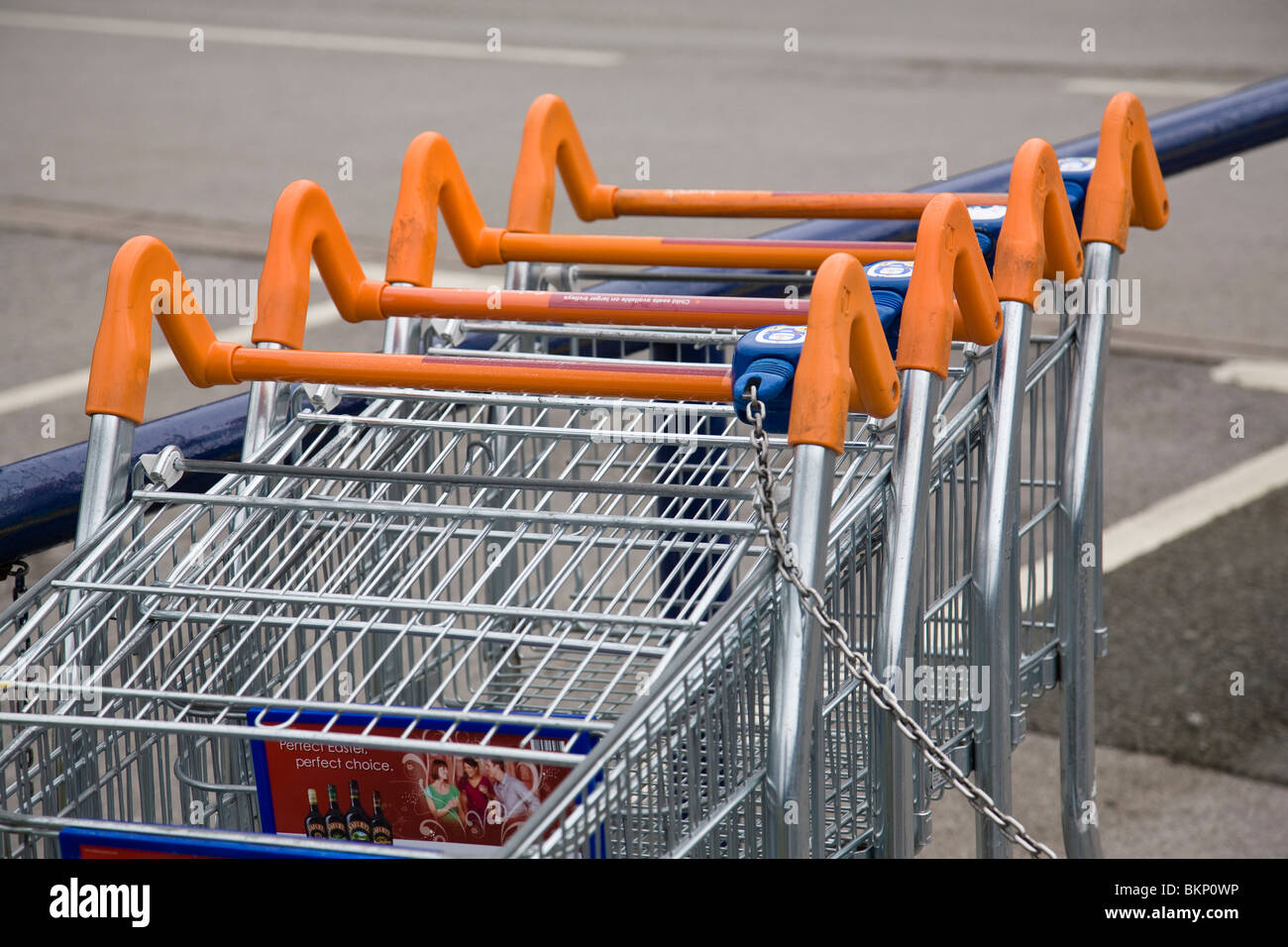 Four shopping trollies chained together, England Stock Photo - Alamy