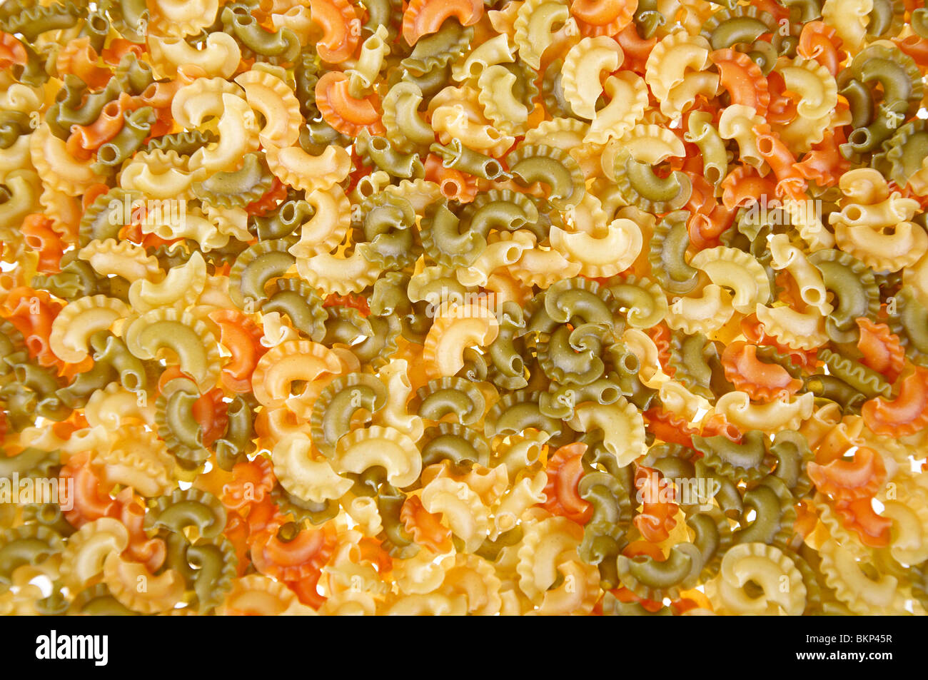 Italian pasta as background, pasta of different colors Stock Photo - Alamy