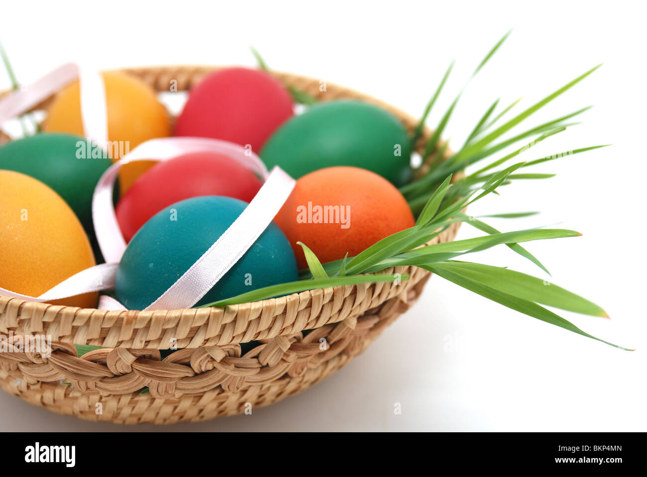 Different color easter eggs in the basket Stock Photo - Alamy