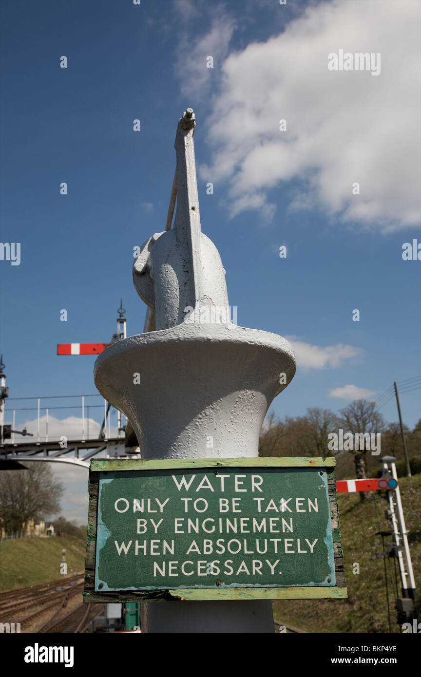 Steam engine water filling station with sign 'Water only to be taken by ...
