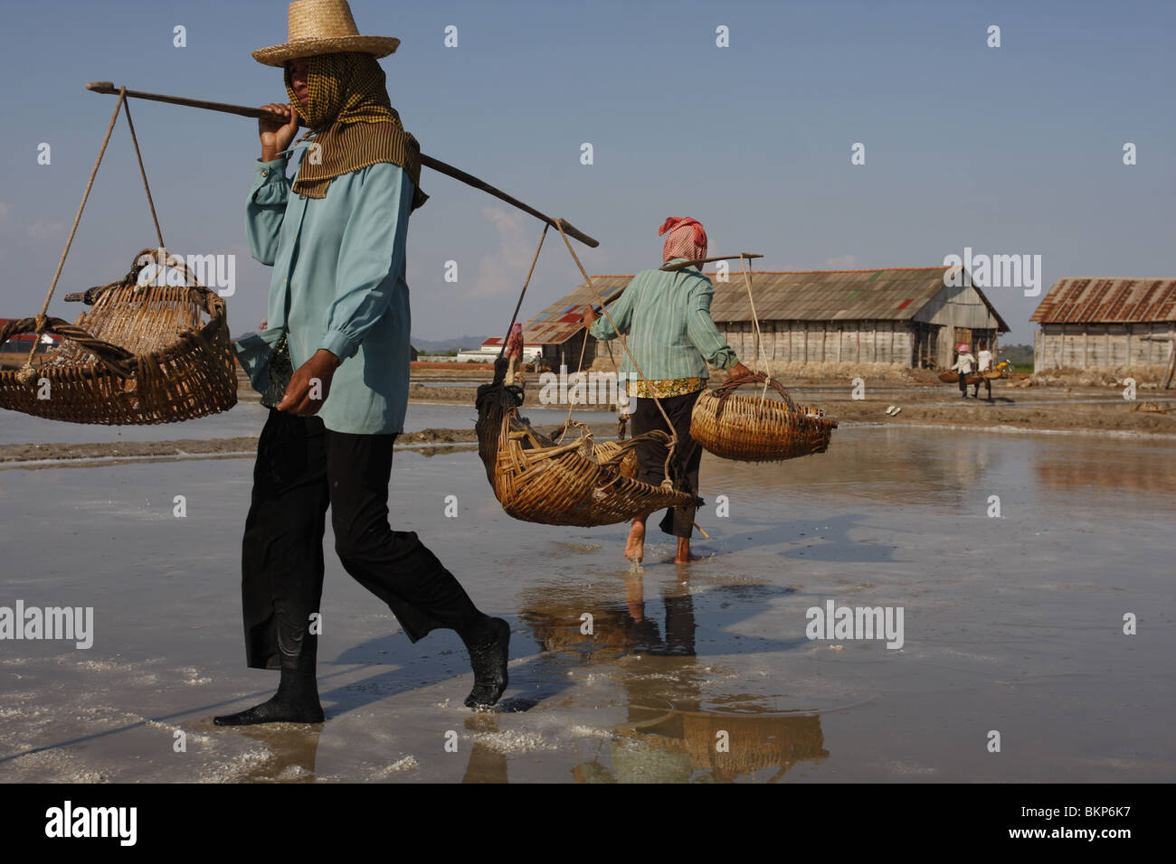 Men and women work in the scorchingly hot salt farms of Kampot ...