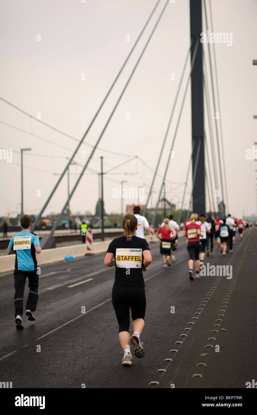 The girl running in the street (Metro marathon, Germany Stock Photo - Alamy