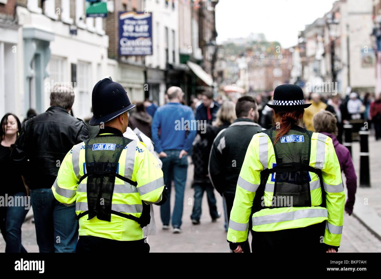 Two Police Officers patrolling in a street Stock Photo - Alamy