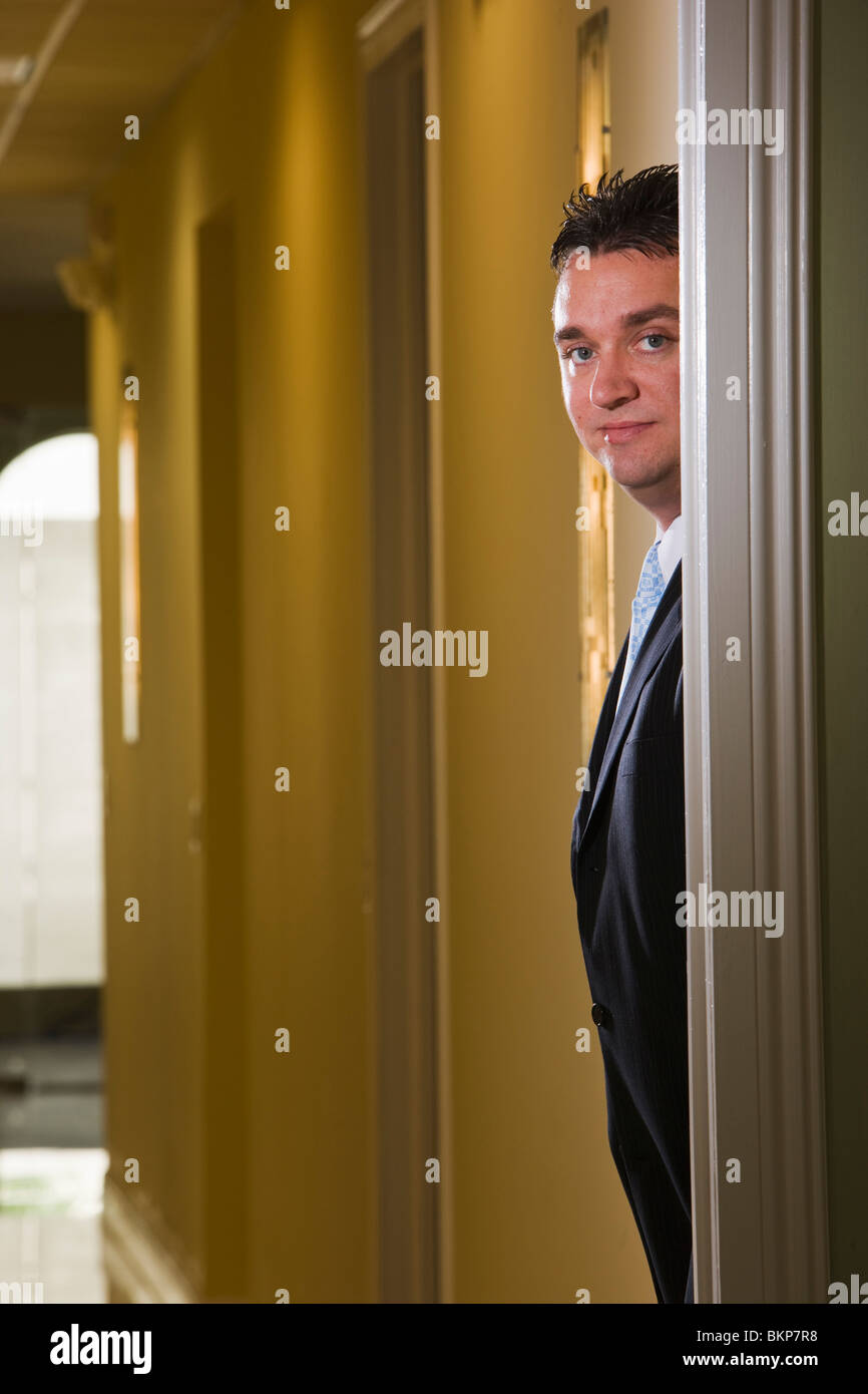 Standing in door frame hi-res stock photography and images - Alamy