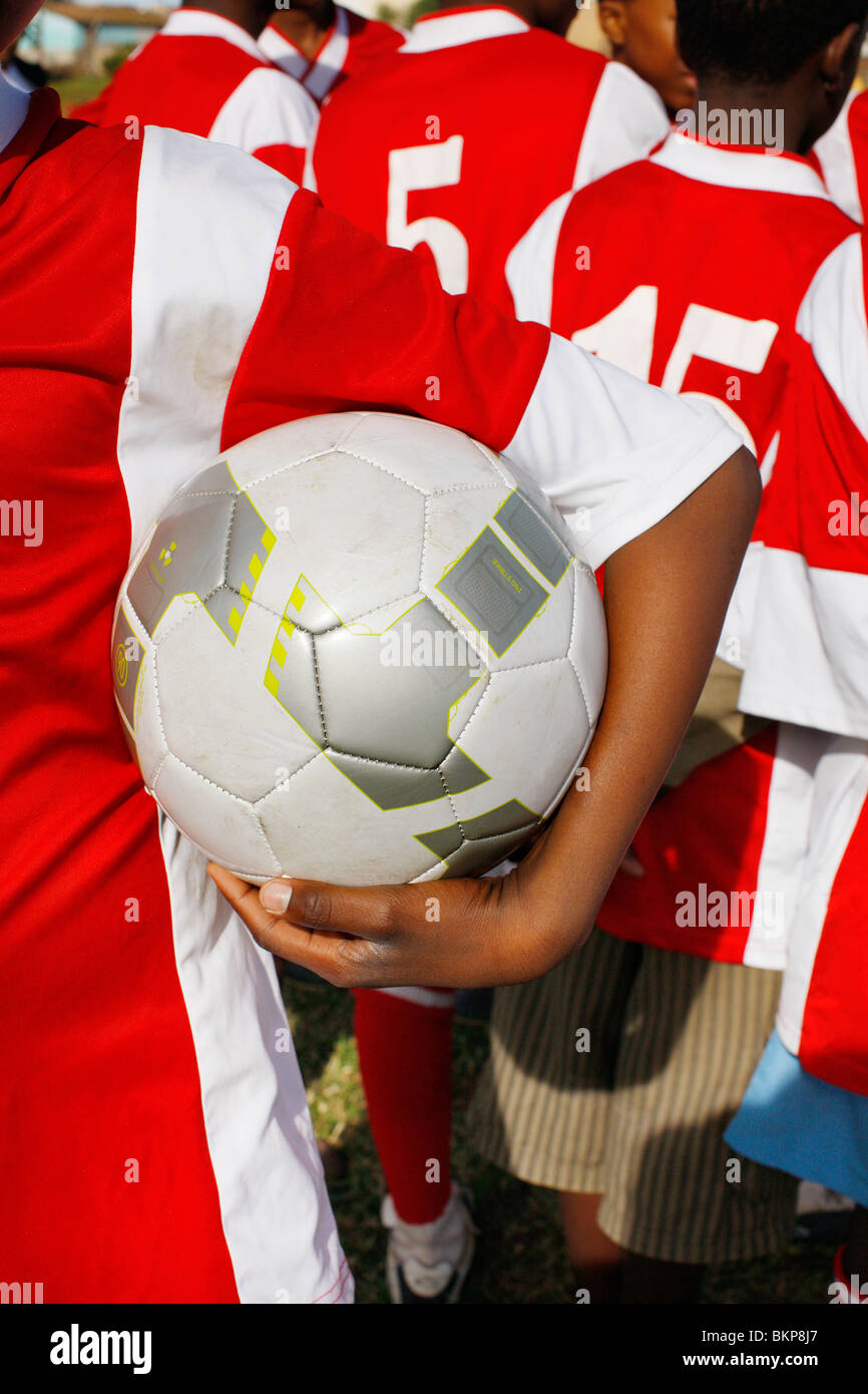 Child holding soccer ball Stock Photo - Alamy