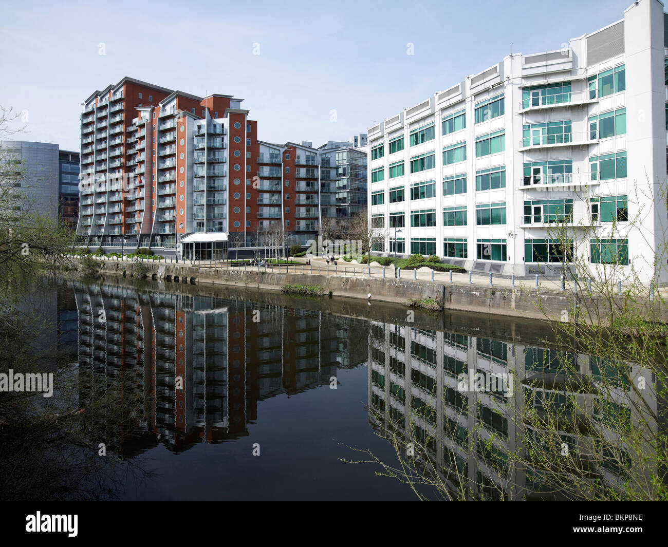 Office buildings reflected in the River Aire, Whitehall Riverside ...