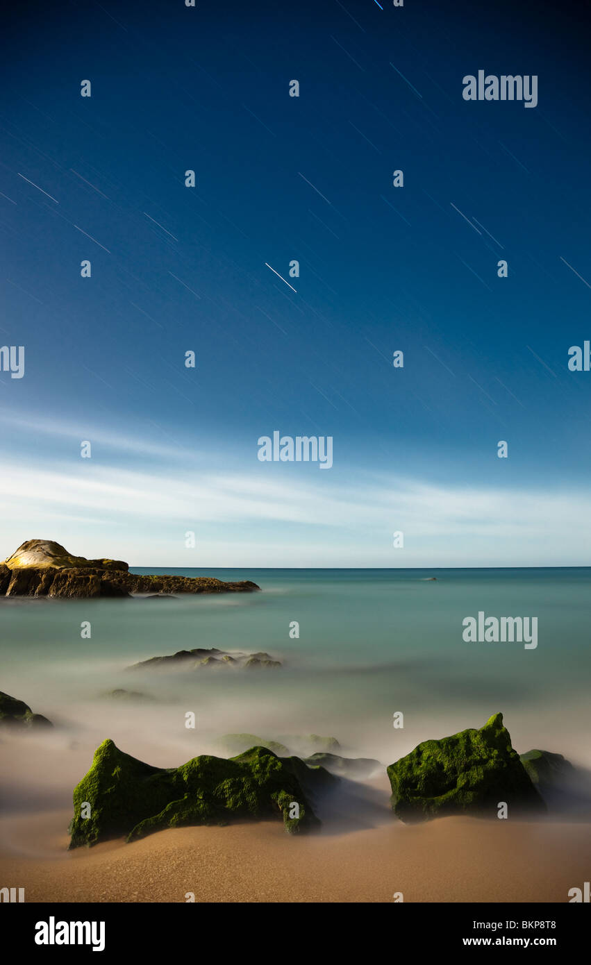 Starry Night on a rocky coast Stock Photo - Alamy