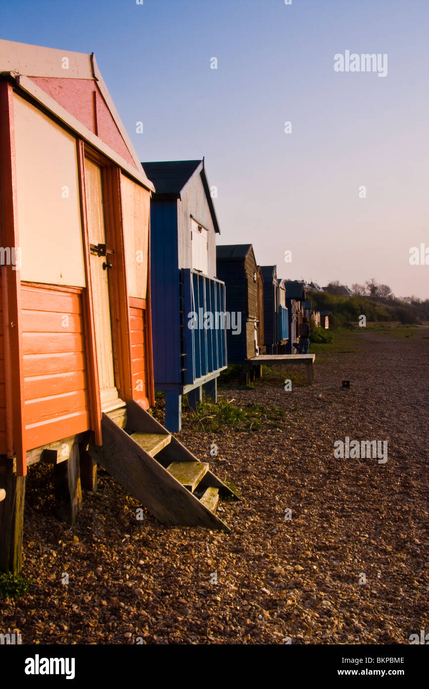 Beach huts in Whitstable at twilight Stock Photo - Alamy
