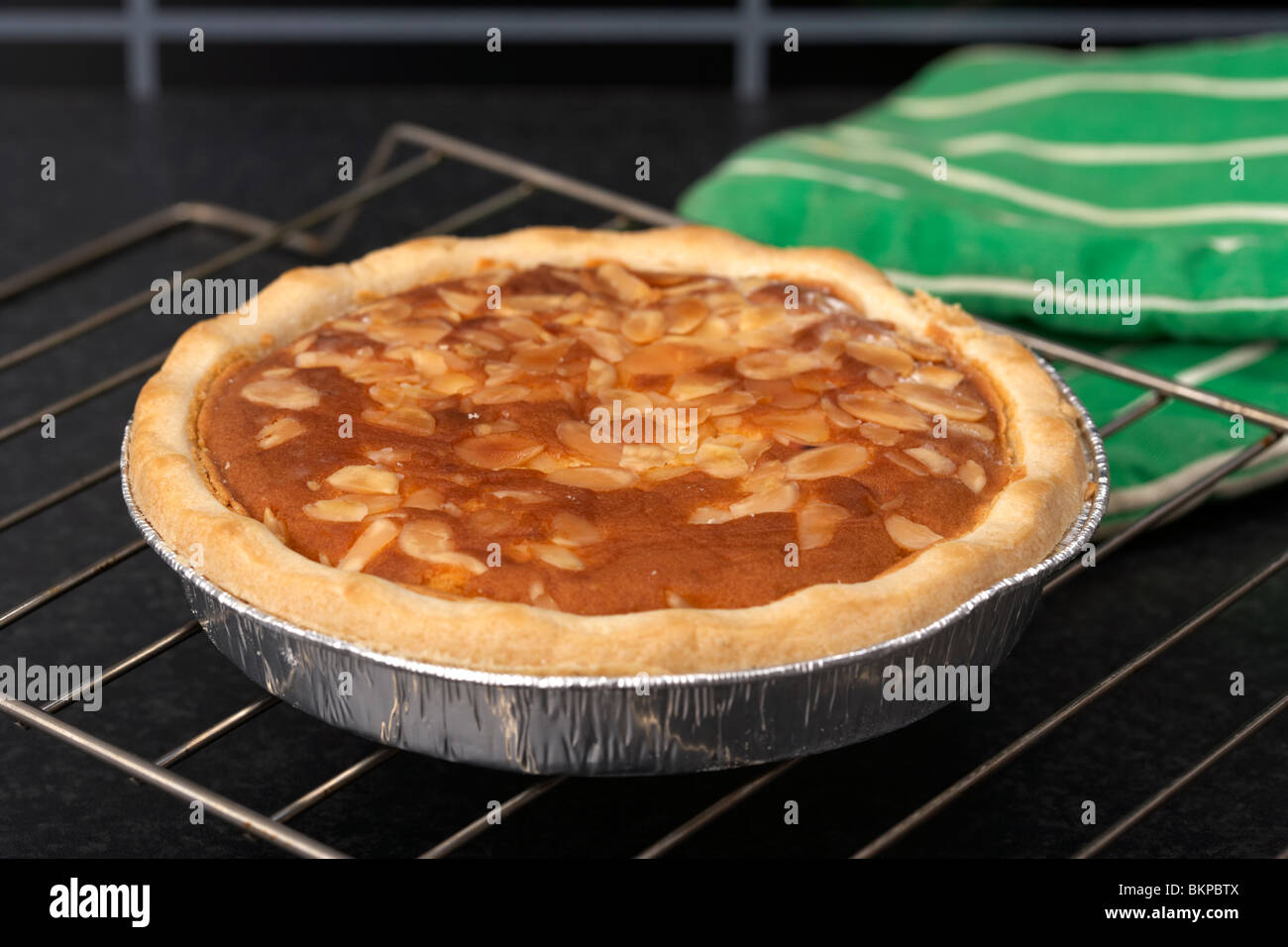 original Bakewell Tart on a wire rack in a kitchen from the Peak ...