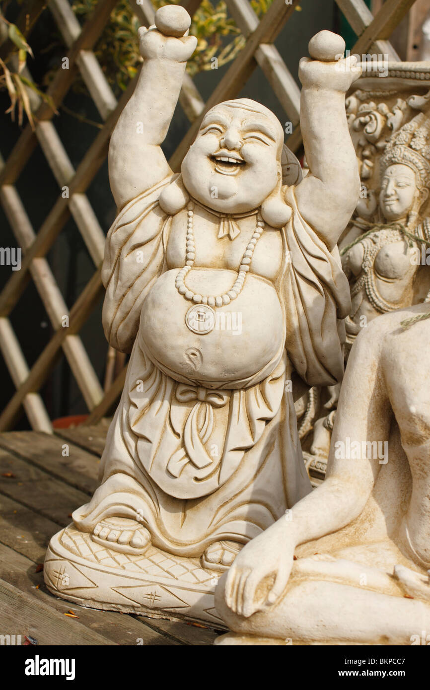 Pot Bellied Thai statue, face Stock Photo - Alamy