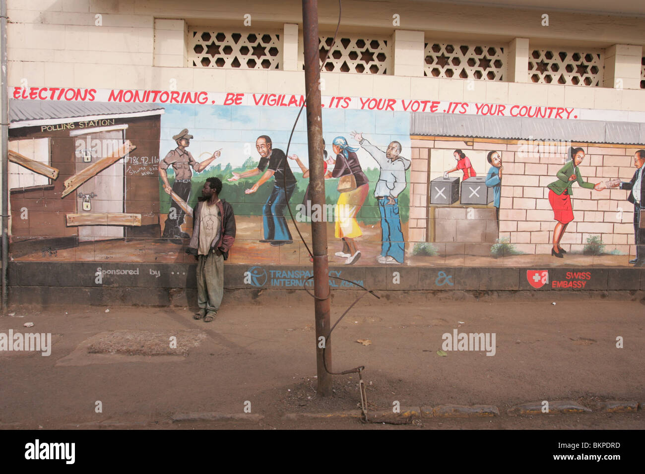 A man stands in front of a mural in Nairobi, Kenya Stock Photo - Alamy