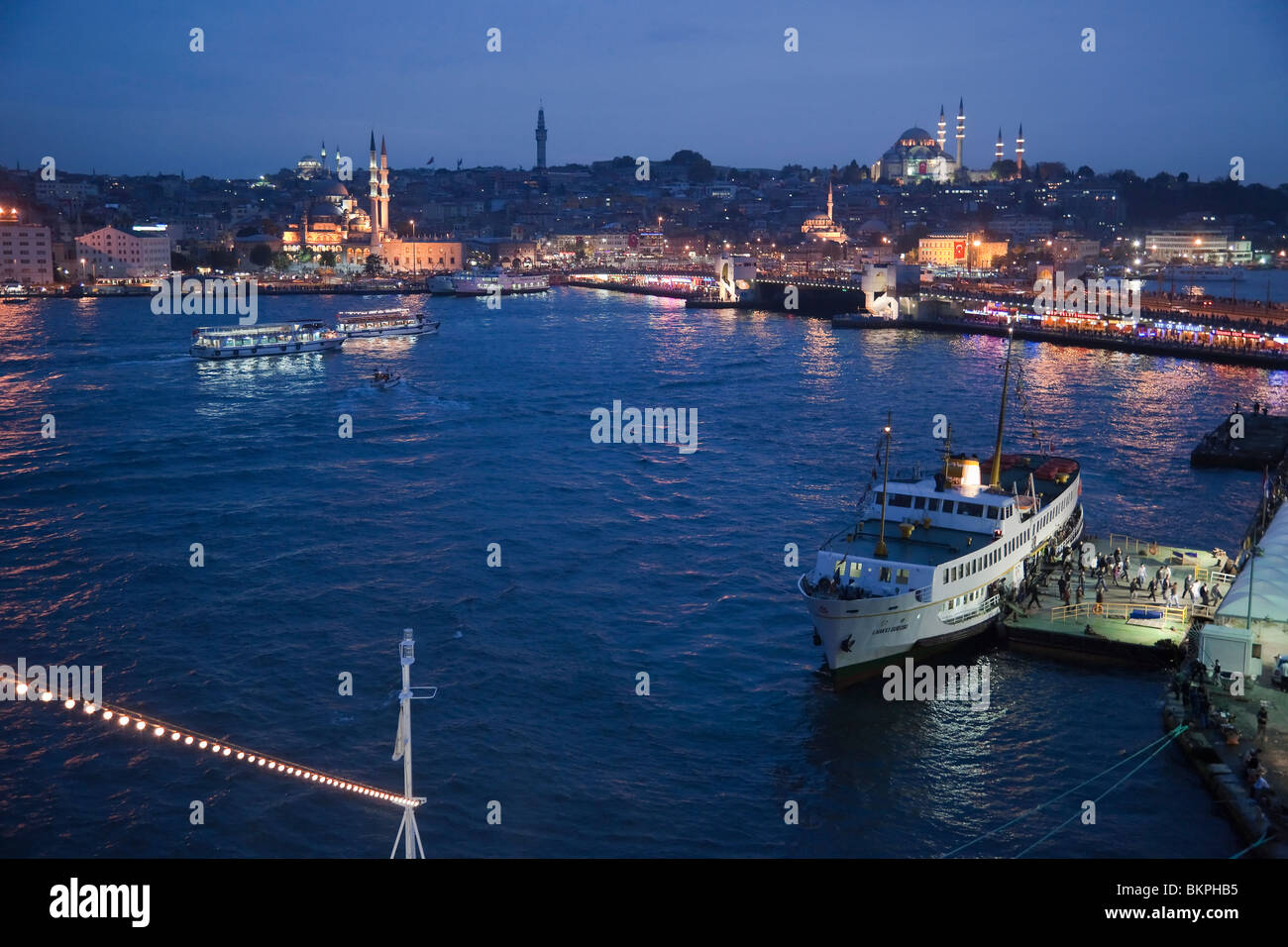 Ferry traffic at night near Galata Bridge in Istanbul,Turkey Stock ...