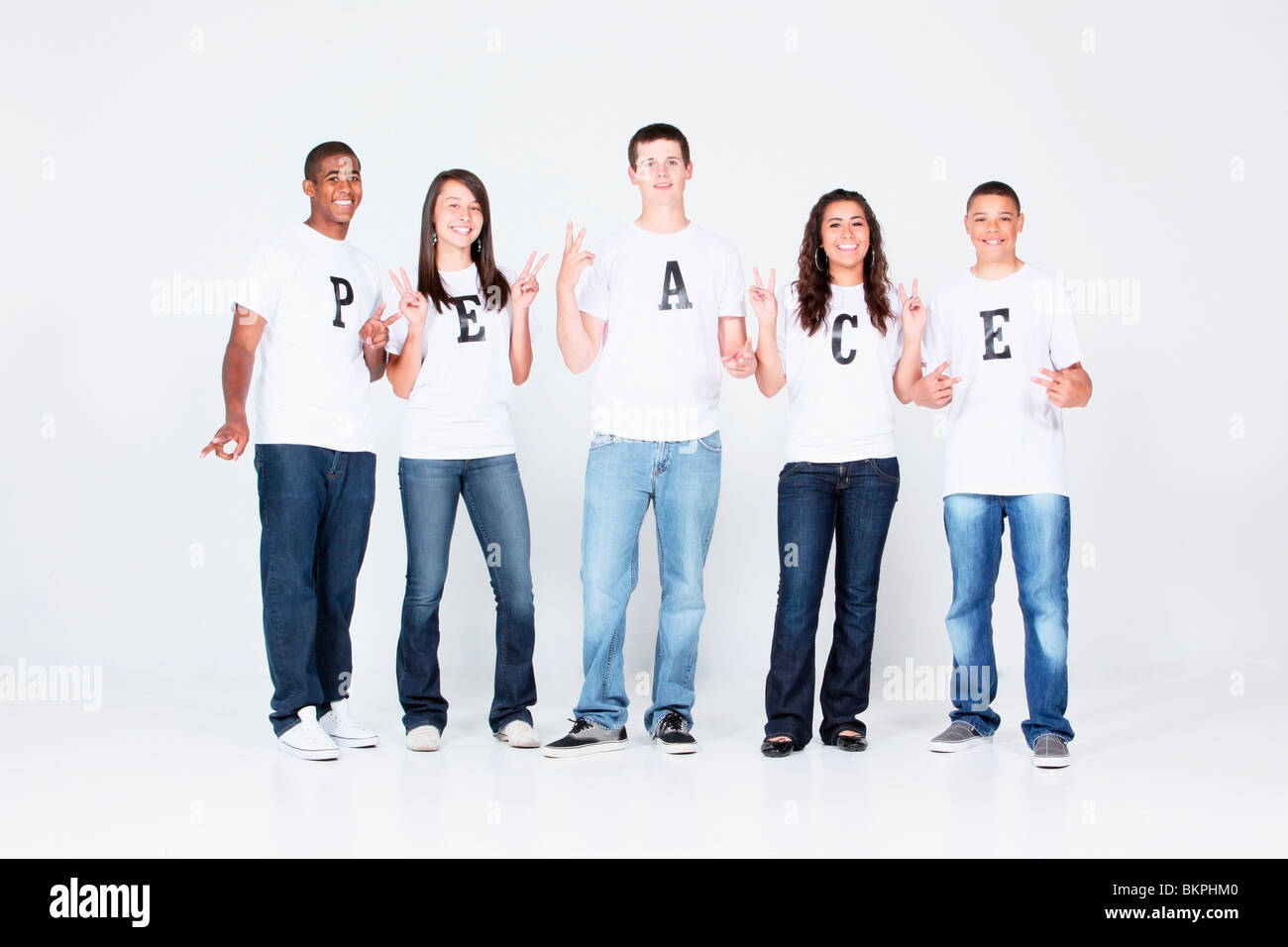 A Group Of Teenagers Making The Peace Sign And Wearing T-Shirts With ...