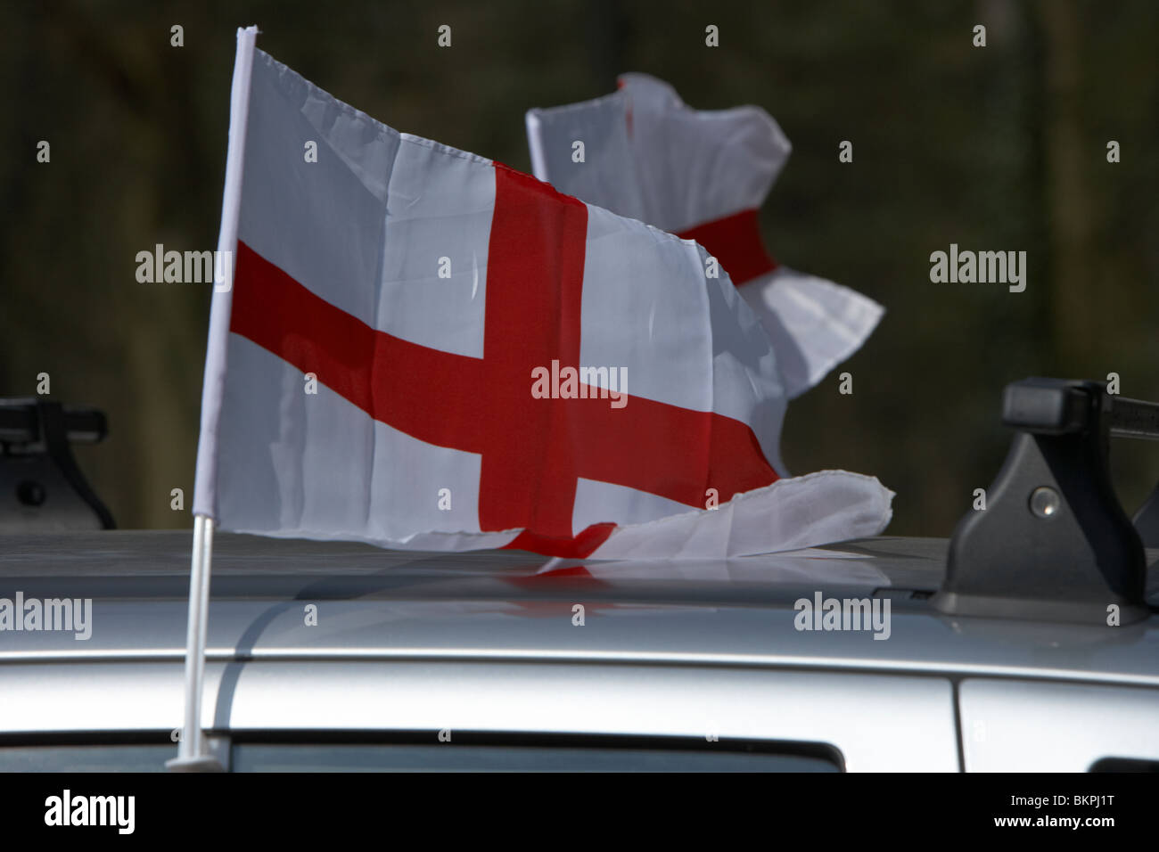 mini cross of St George english national flag flying on a car on st ...