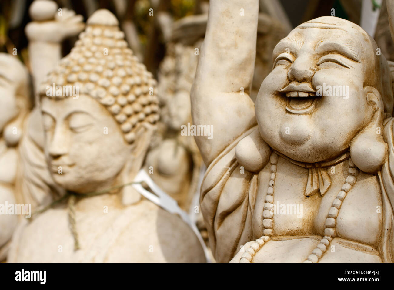 Pot Bellied Thai statue, face Stock Photo - Alamy