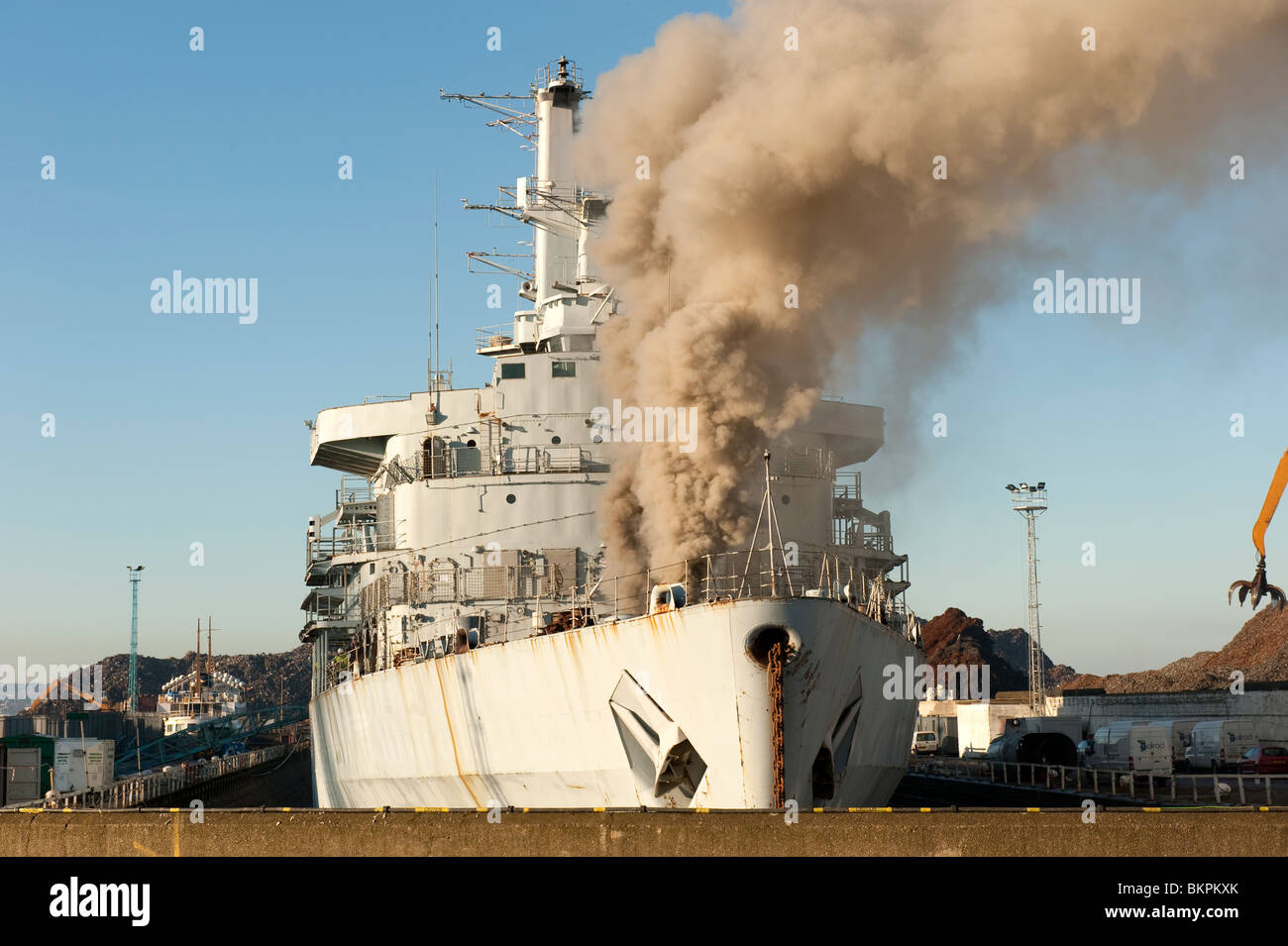 Ex Navy Ship on fire in dock with large volumes of smoke coming from ...