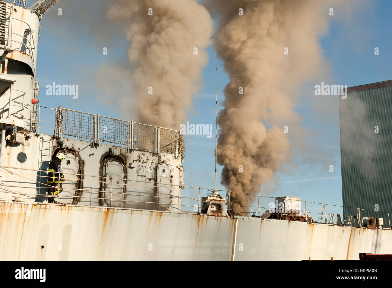 Ex Navy Ship on fire in dock with large volumes of smoke coming from ...