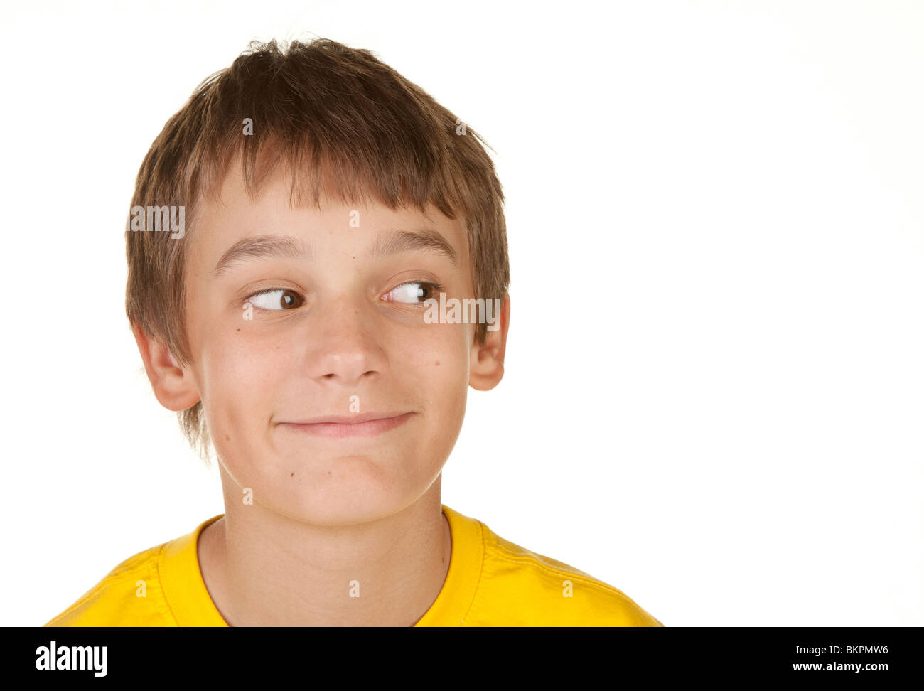 boy looks over at the copy space isolated on white Stock Photo - Alamy