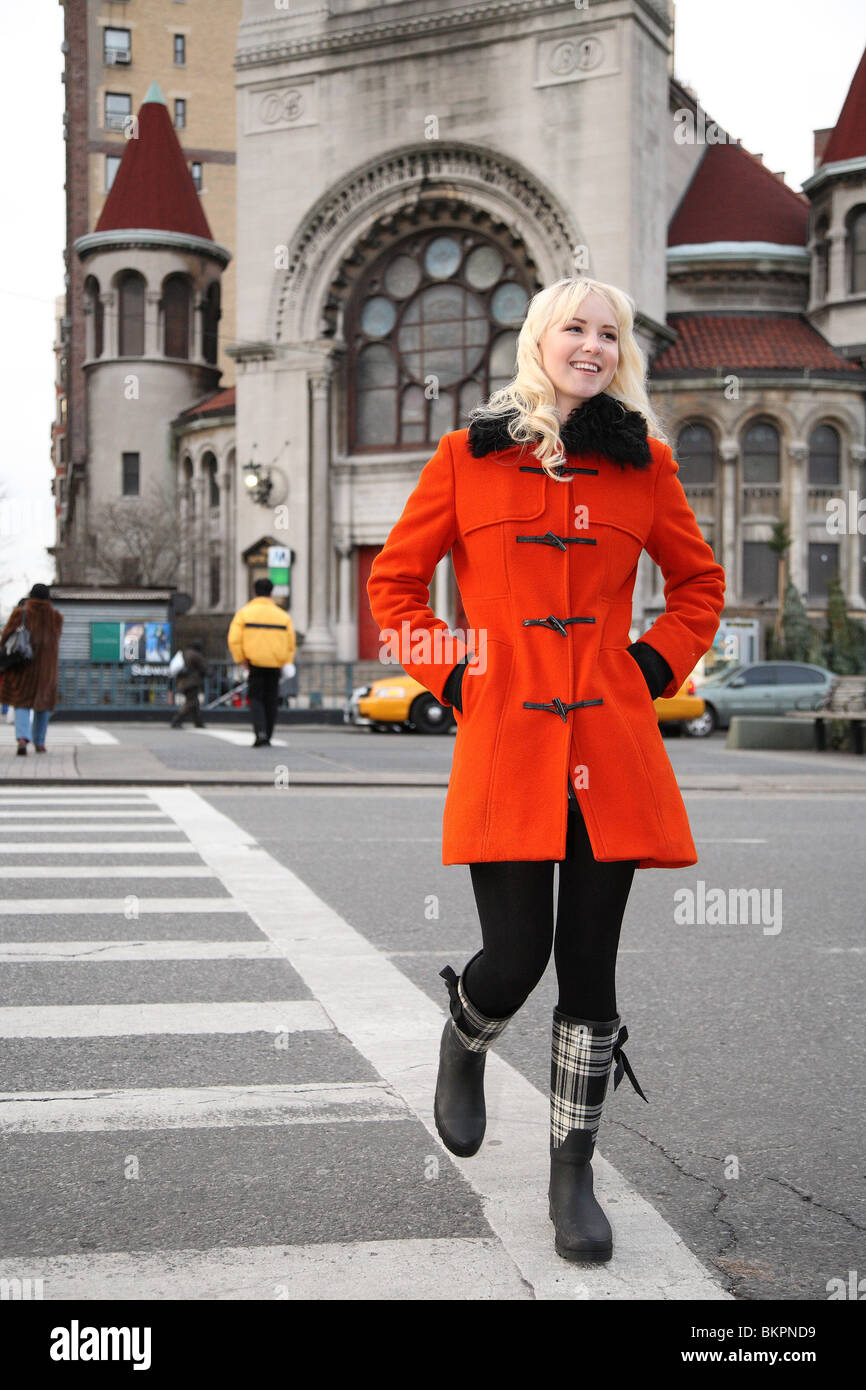 Young woman city walking happy across street Stock Photo - Alamy