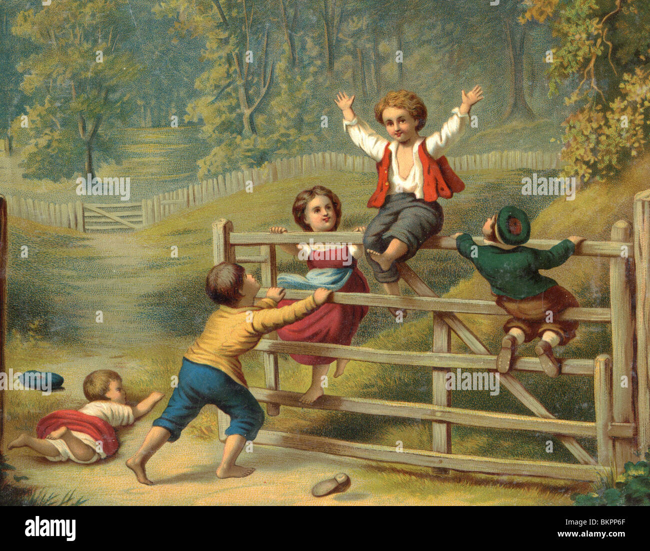 Children Playing on a Wooden Gate in the Countryside Stock Photo - Alamy
