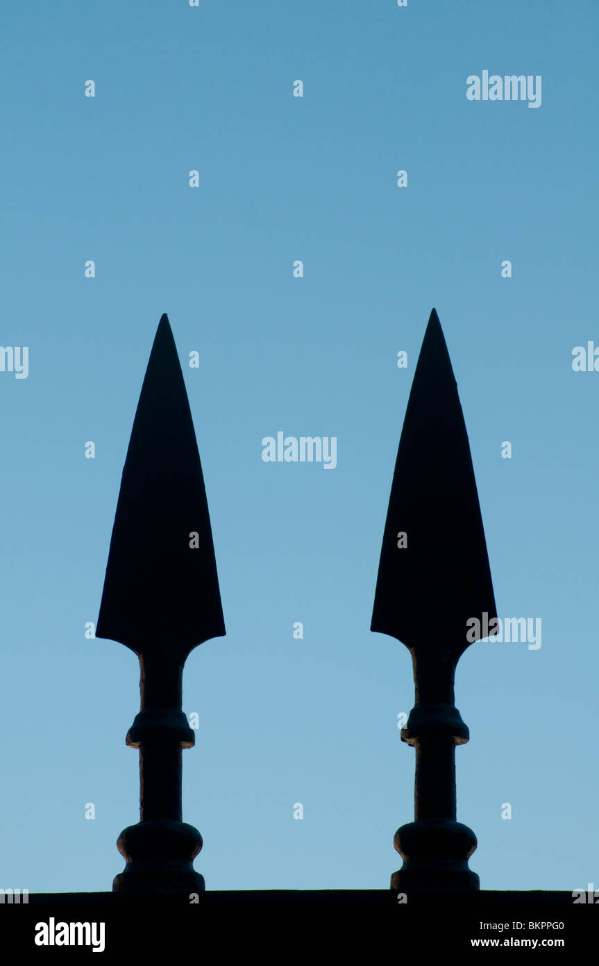 Two arrows against blue sky Stock Photo - Alamy