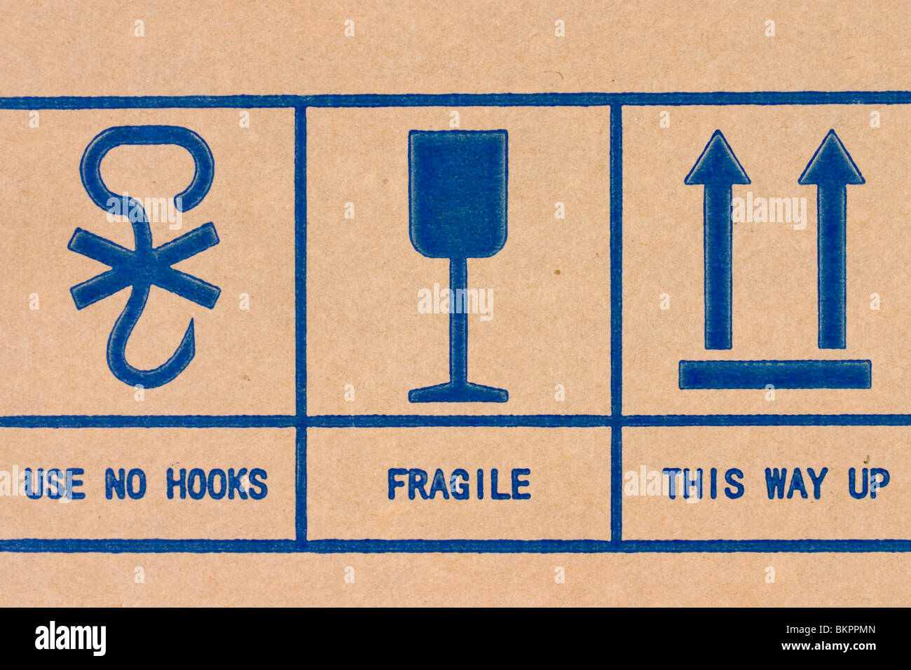 Handling instructions on a cardboard box Stock Photo - Alamy