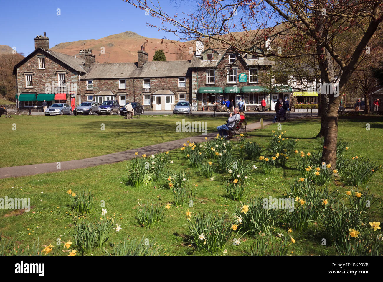 Grasmere, Cumbria, England, UK. Pretty village green with Daffodils in ...