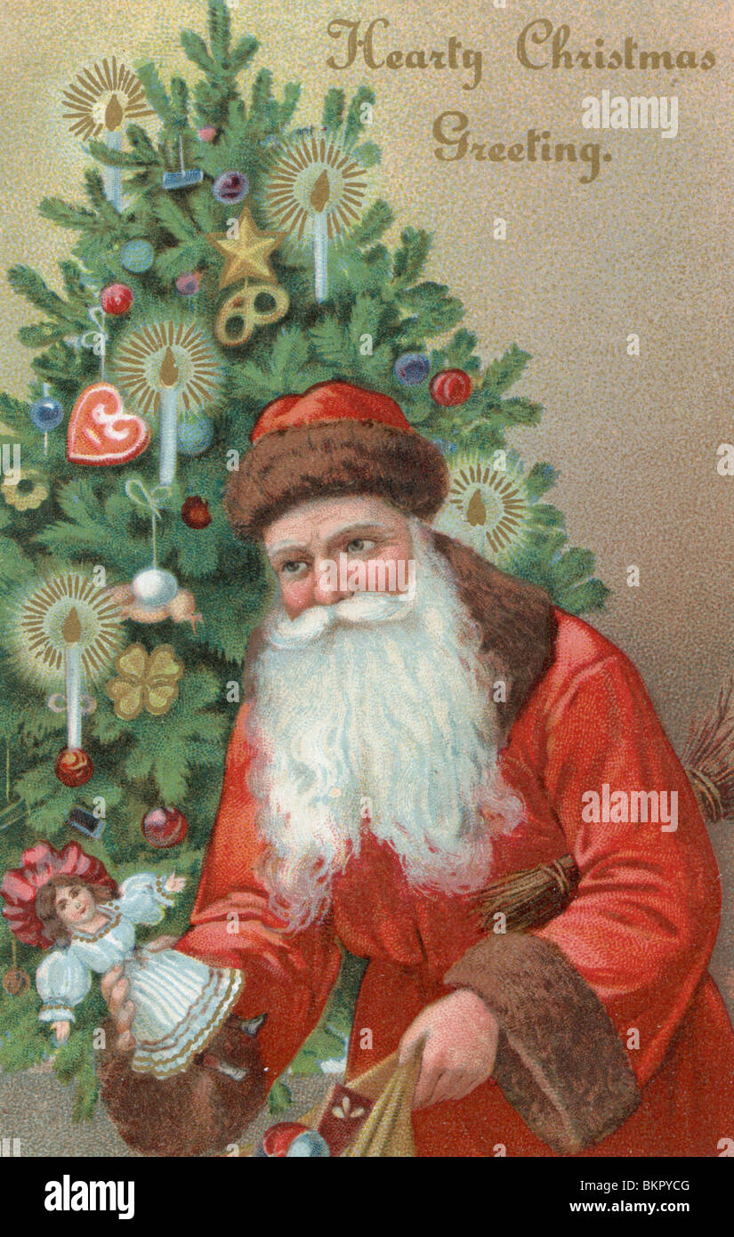 Father Christmas Placing the Toys under the Christmas Tree Stock Photo ...