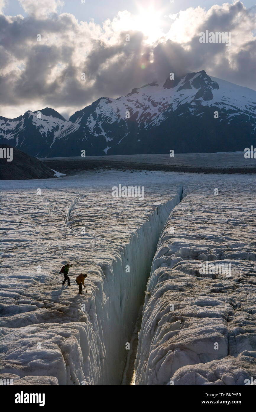 Trekkers explore a huge crevasse on the Mendenhall Glacier, Juneau Ice ...